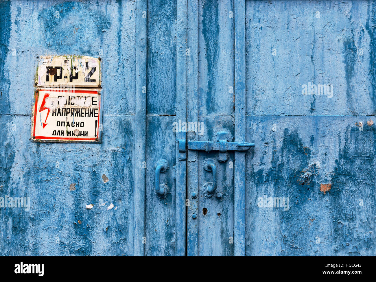 Big industrial metal door with rusty cracked paint Stock Photo - Alamy
