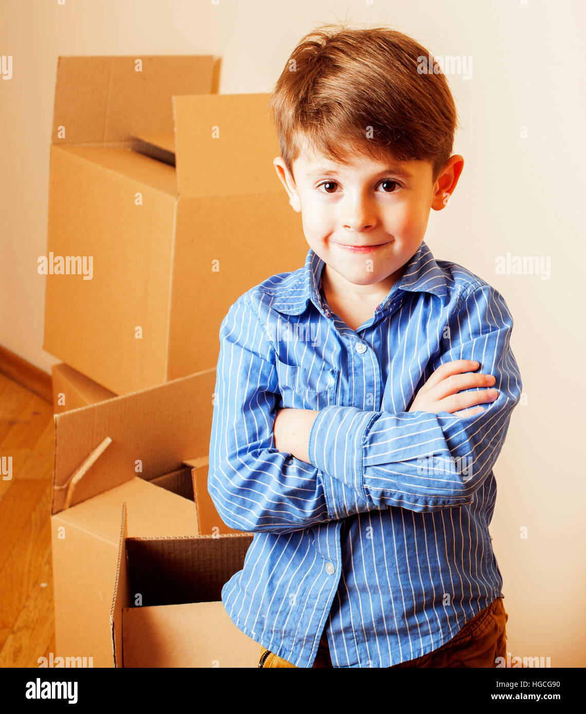 little cute boy in empty room, remoove to new house. home alone Stock ...