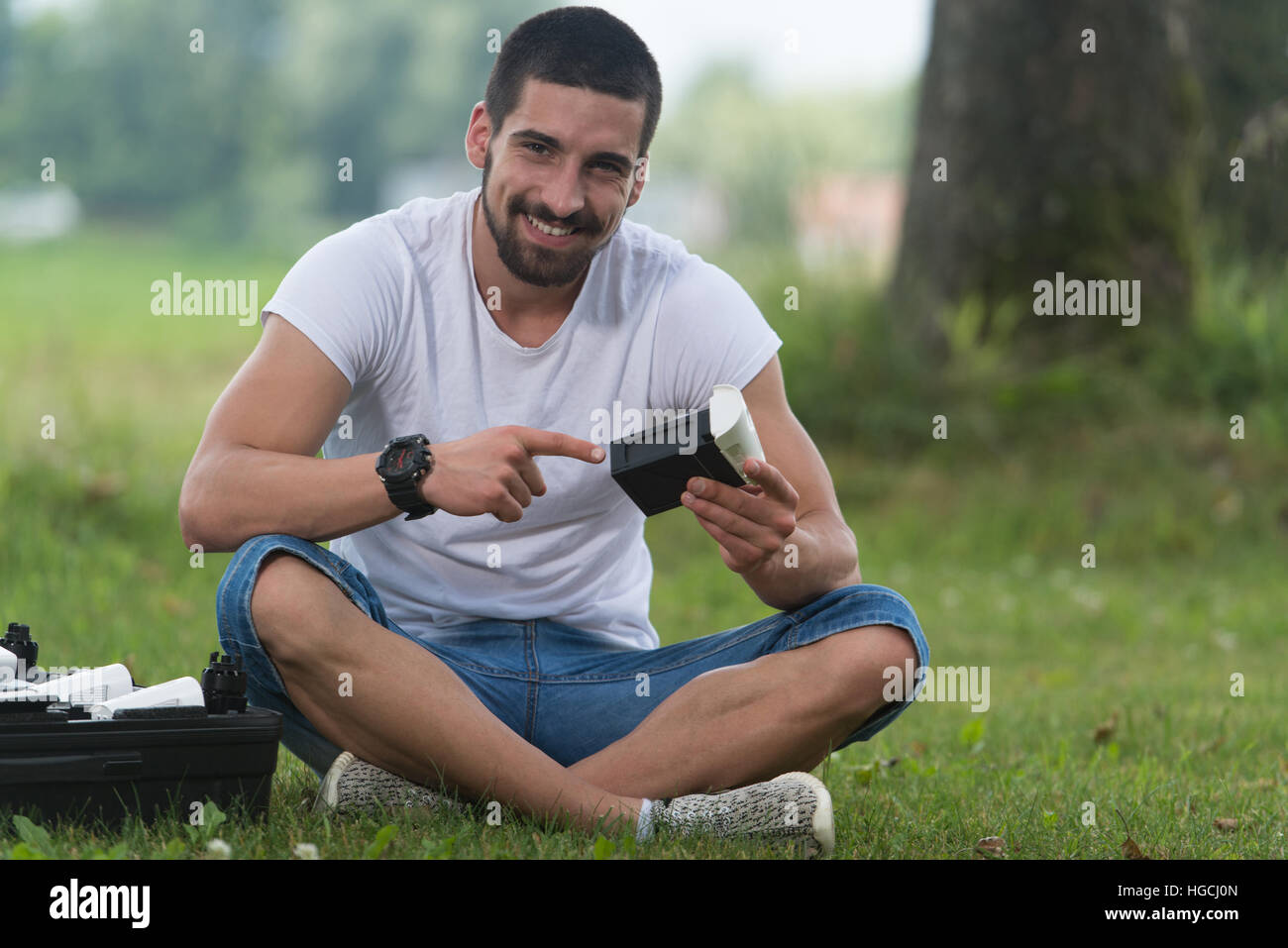 Closeup of Young Engineer Man Checking the Battery of Uav Drone With ...