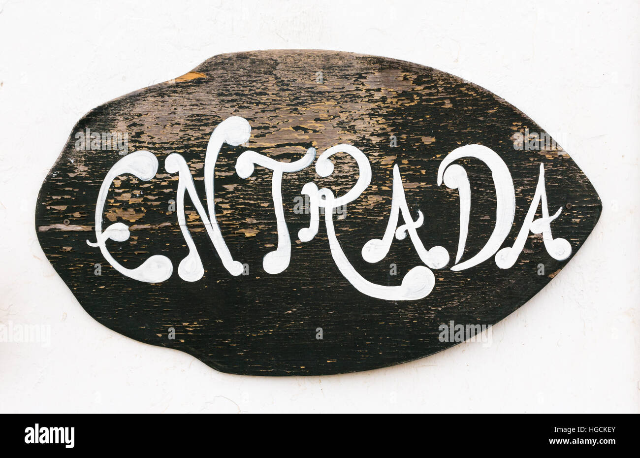 Sign Entrance on old wood - Entrada Stock Photo - Alamy