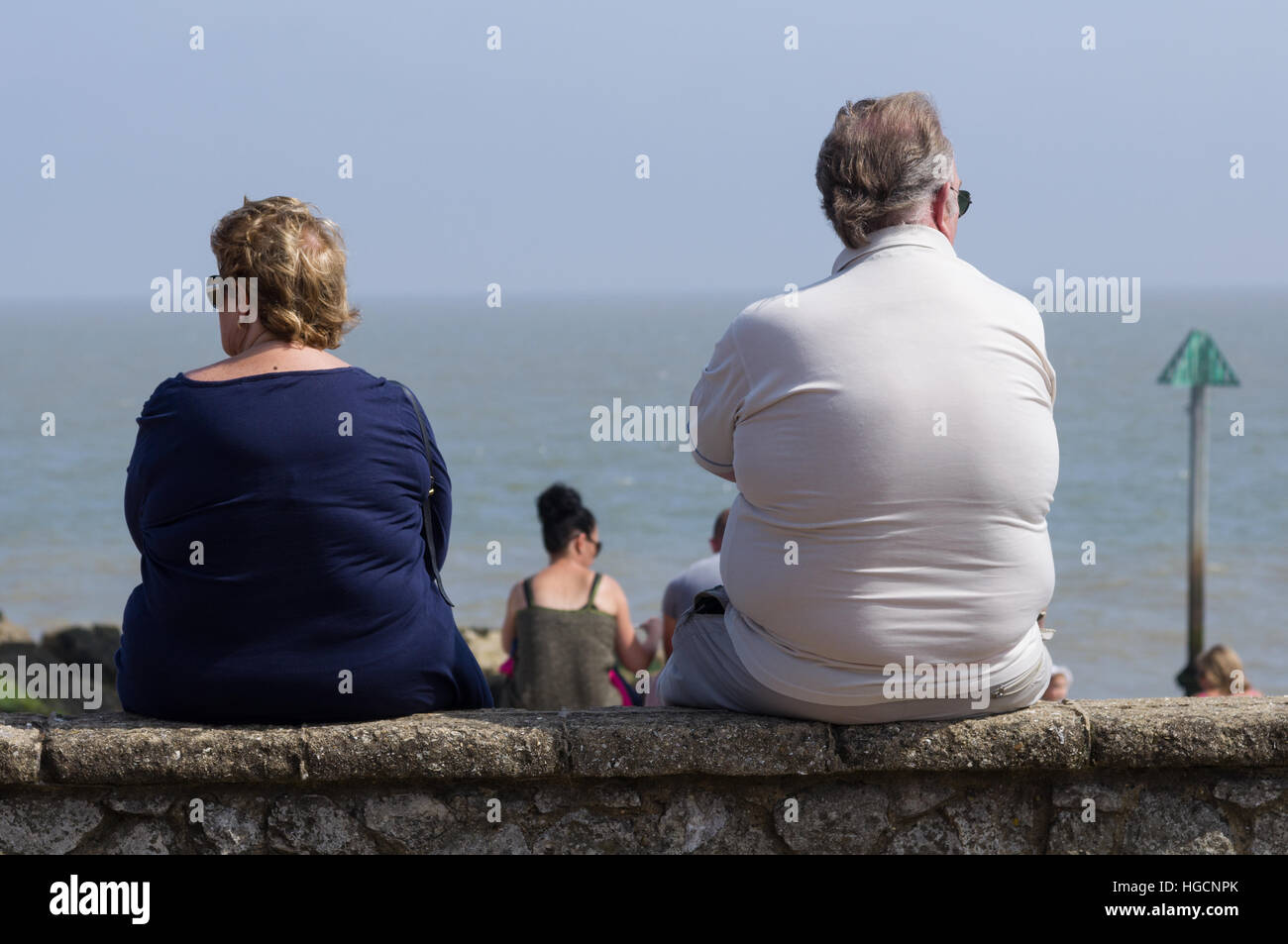 Fat man woman sitting on hi-res stock photography and images - Alamy