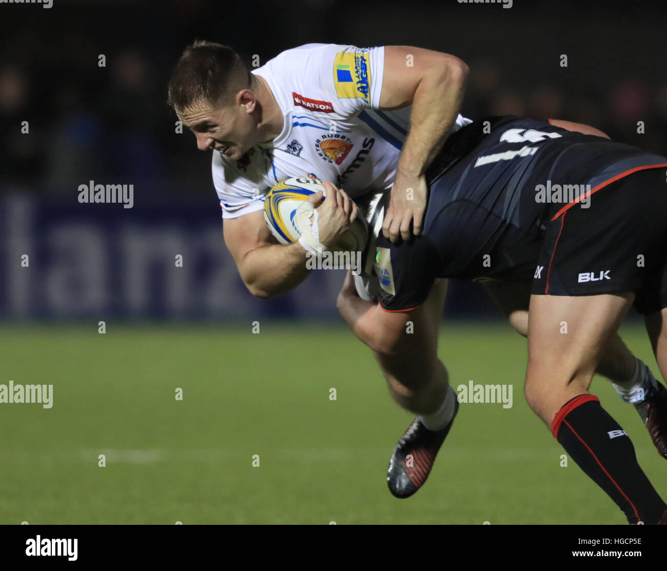 Saracens' Jamie George tackles Exeter Chiefs' Sam Hill during the Aviva ...