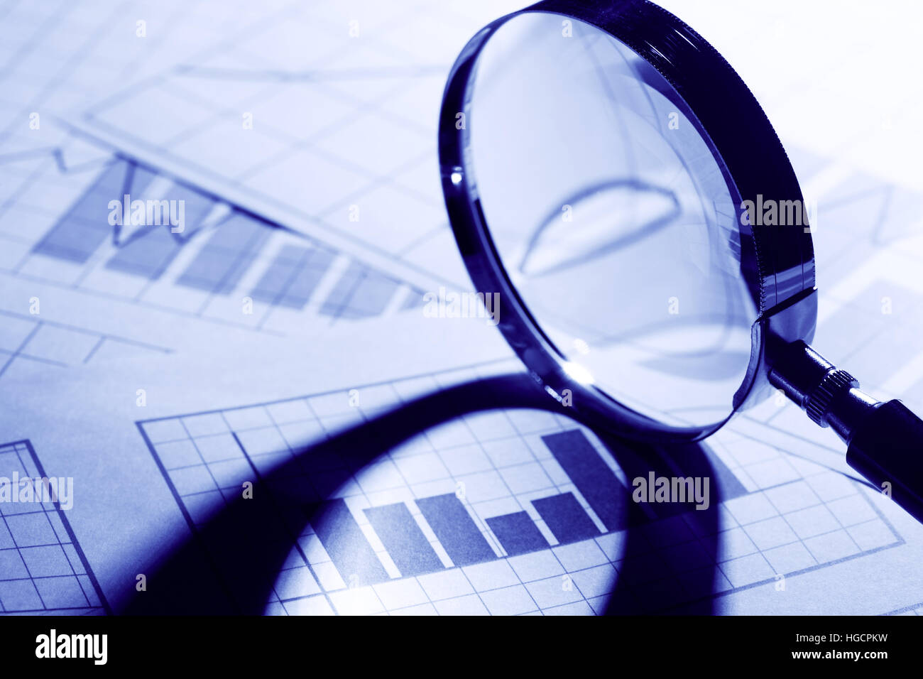 Business concept. Magnifying glass on paper background with chart Stock ...