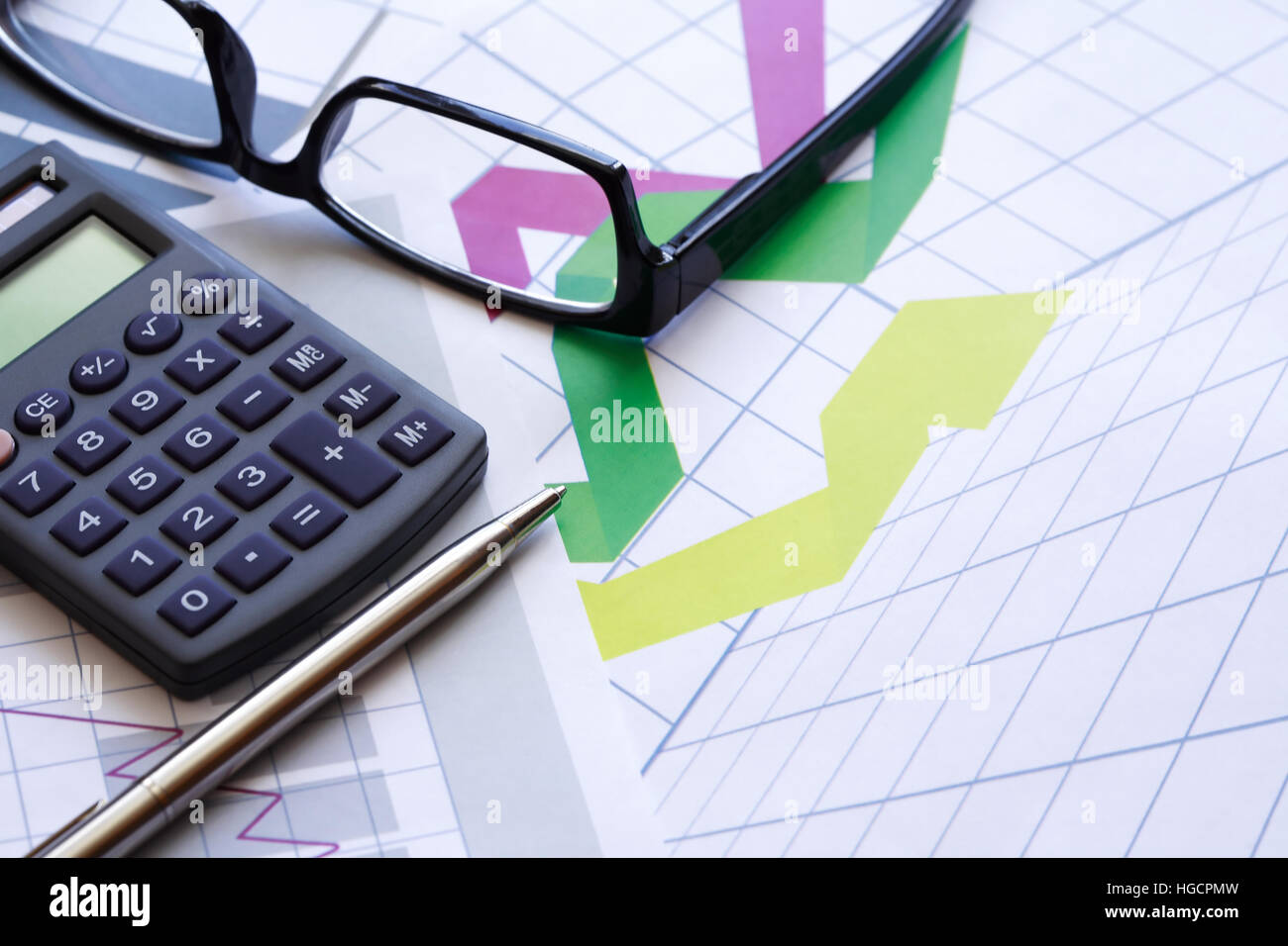 Business concept. Calculator and stectacles on paper background with ...