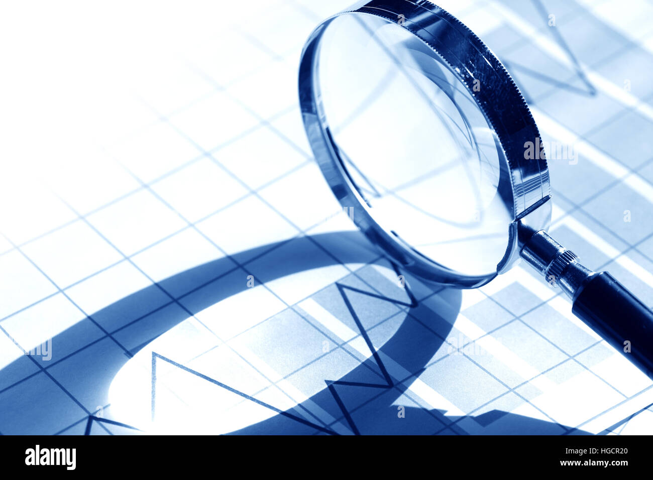 Business concept. Magnifying glass on paper background with chart Stock ...