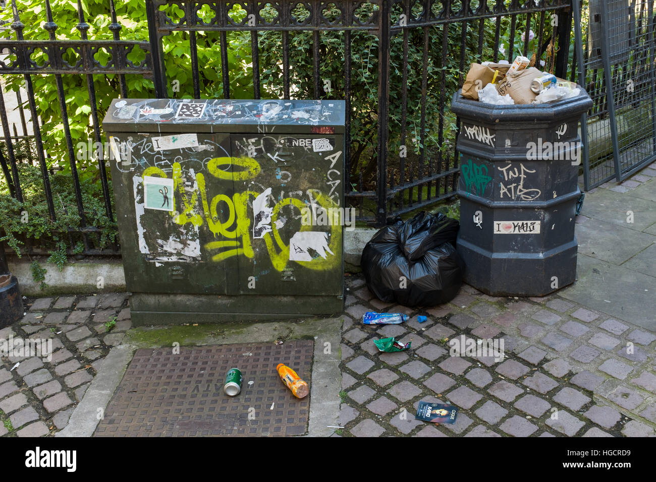 Overflowing rubbish or trash bin Stock Photo - Alamy