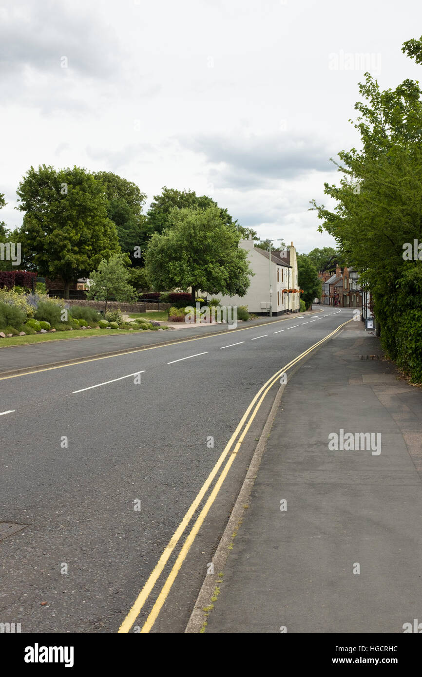 Double yellow lines in road Stock Photo - Alamy