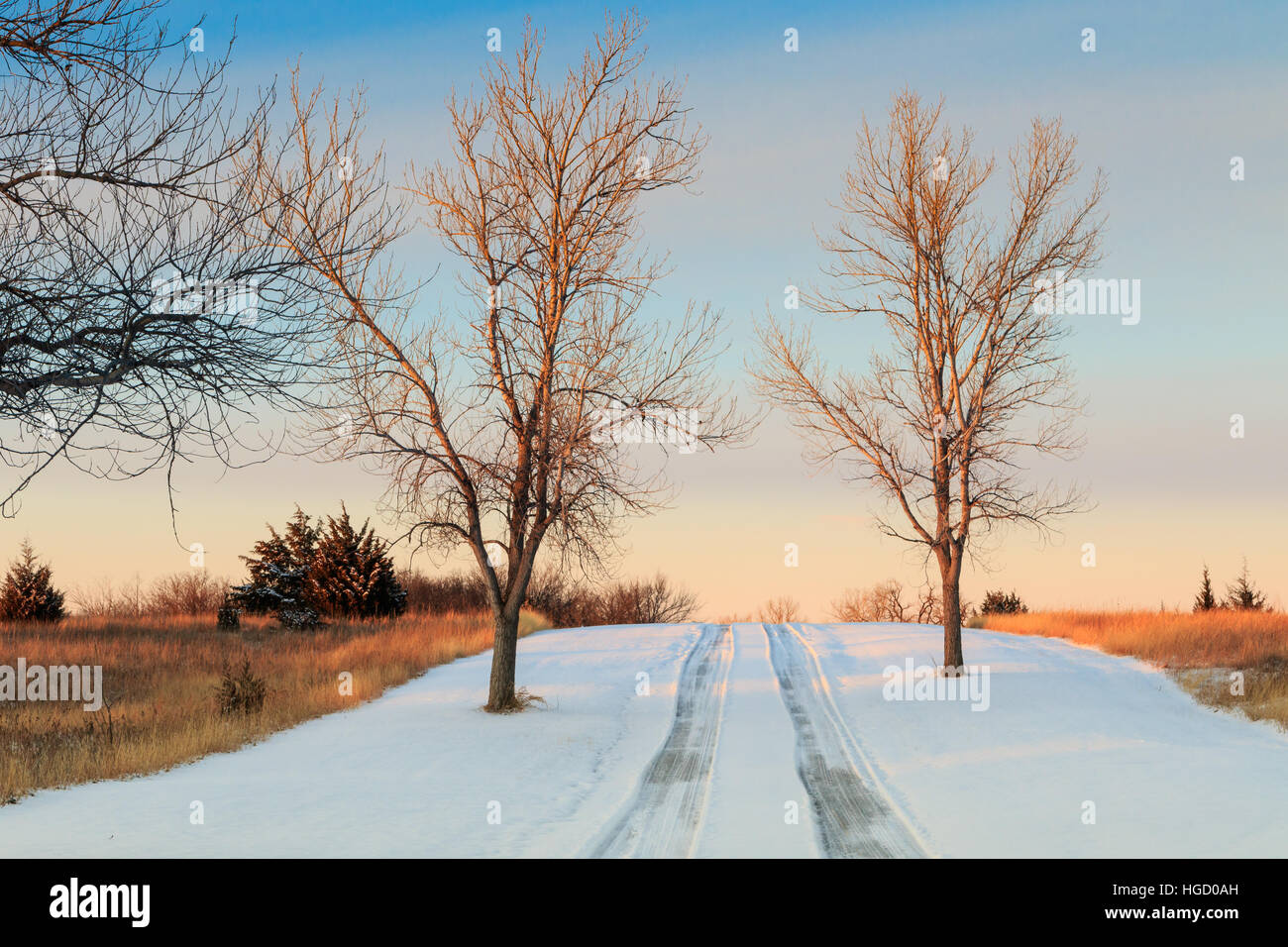 A snow covered rural road at the end of a cold day Stock Photo - Alamy