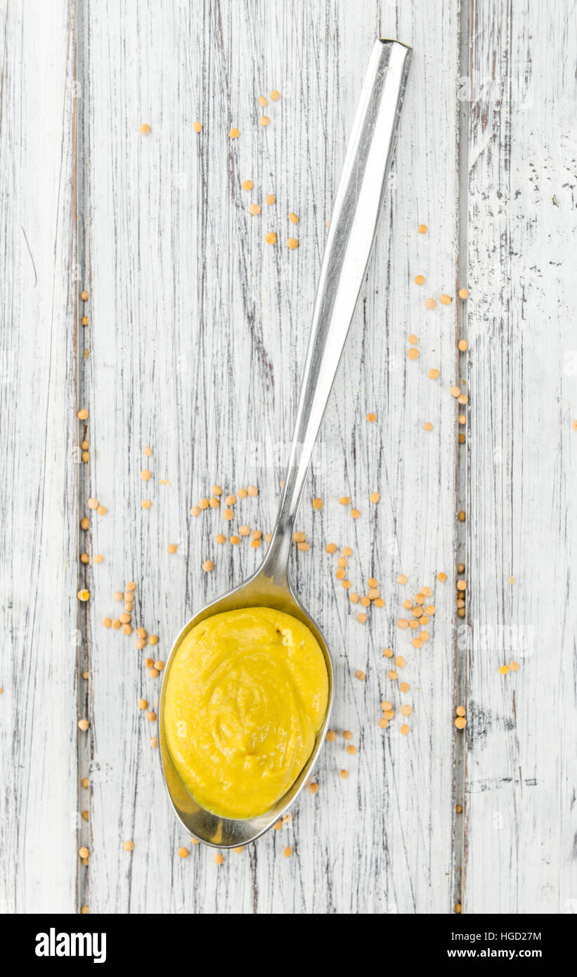 Fresh made Mustard on a vintage background (close-up shot Stock Photo ...