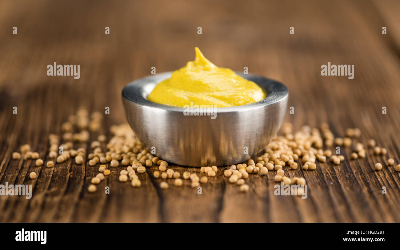 Mustard on a vintage background as detailed close-up shot (selective ...