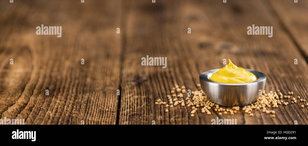 Mustard on a vintage background as detailed close-up shot (selective ...