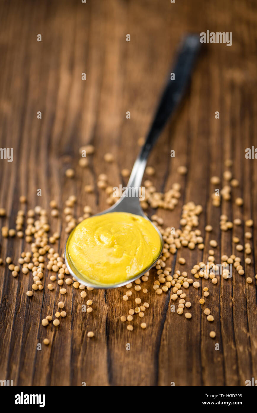 Fresh made Mustard on a vintage background (close-up shot Stock Photo ...