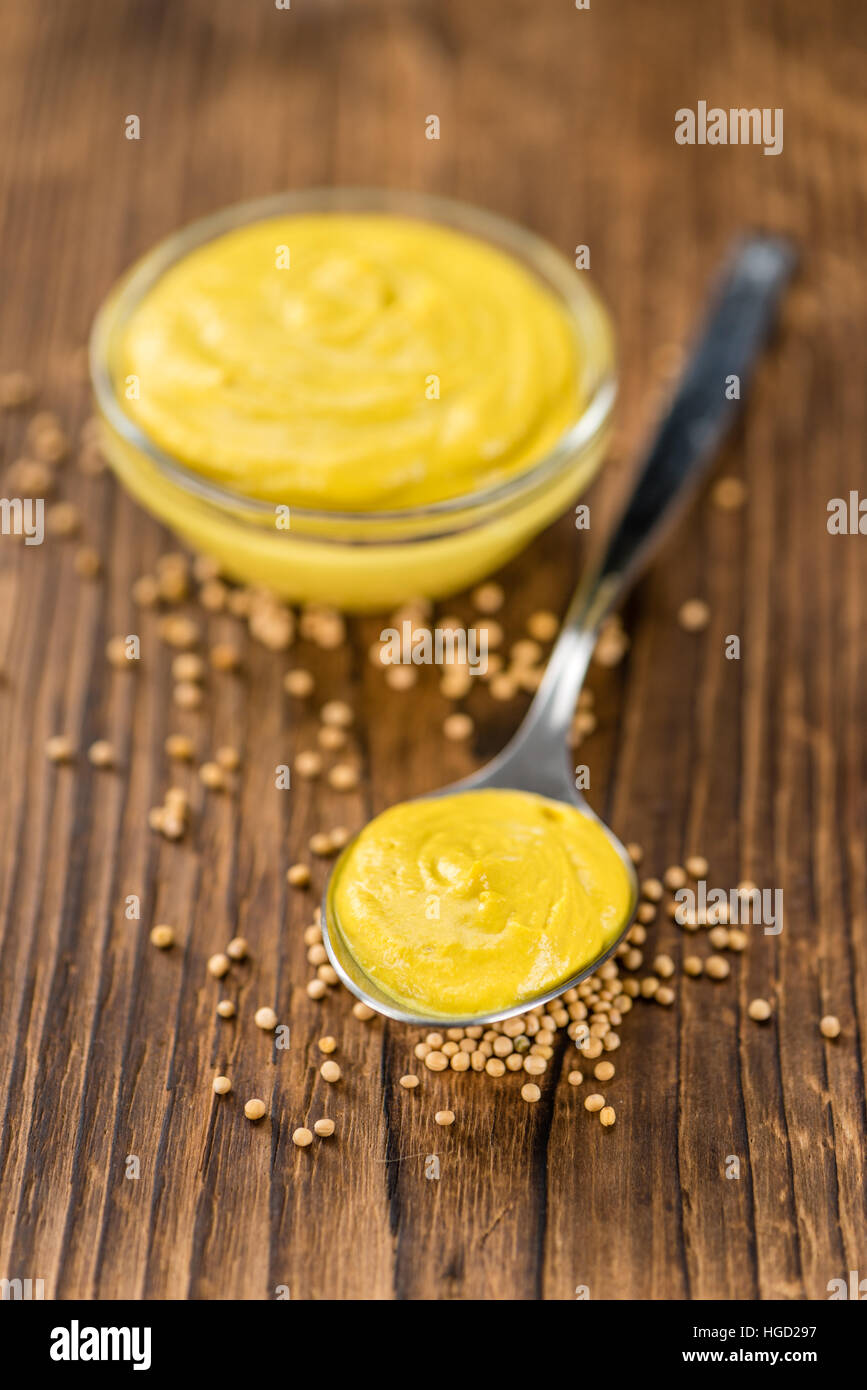 Fresh made Mustard on a vintage background (close-up shot Stock Photo ...