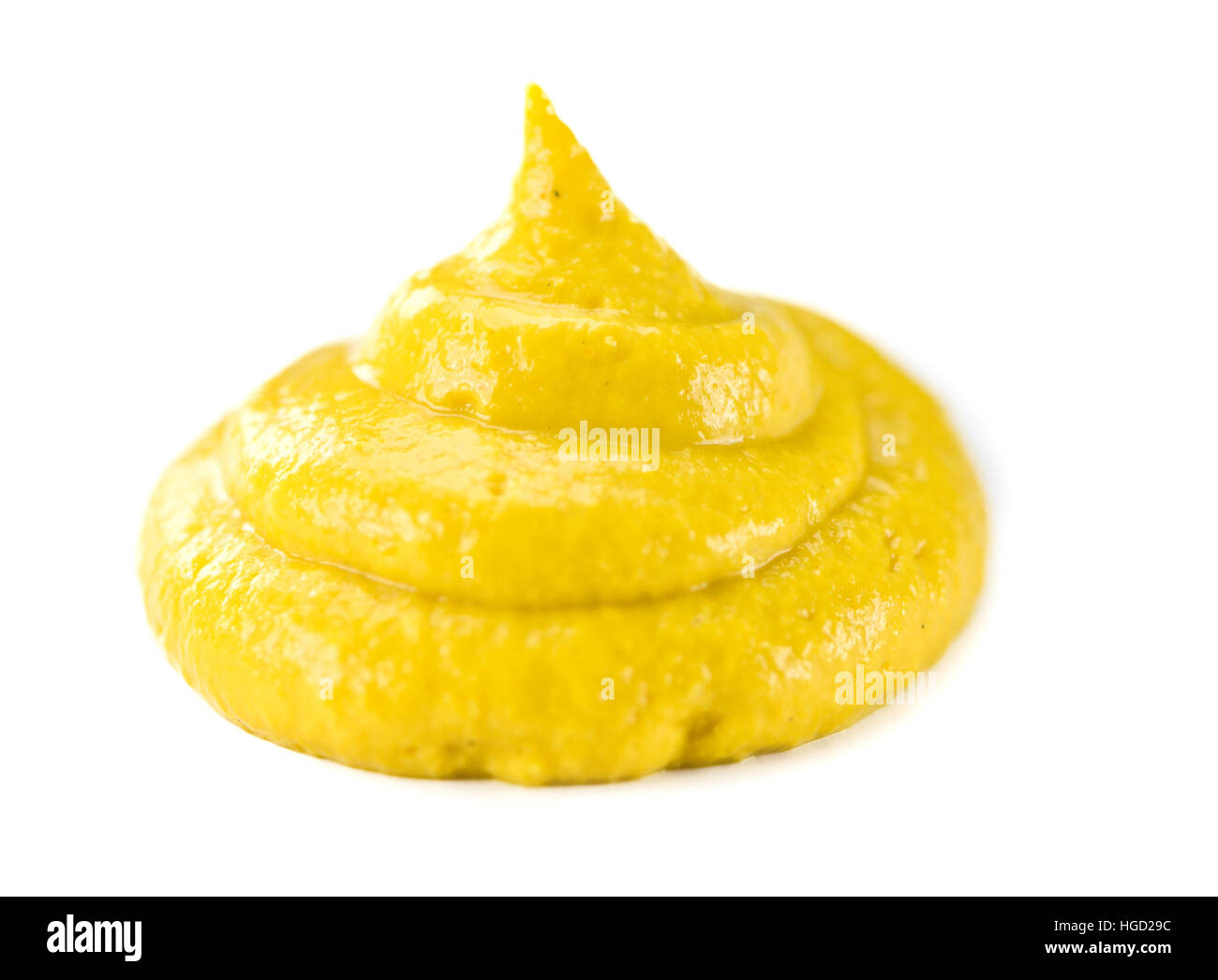 Portion of Mustard (as close-up shot) isolated on white background ...