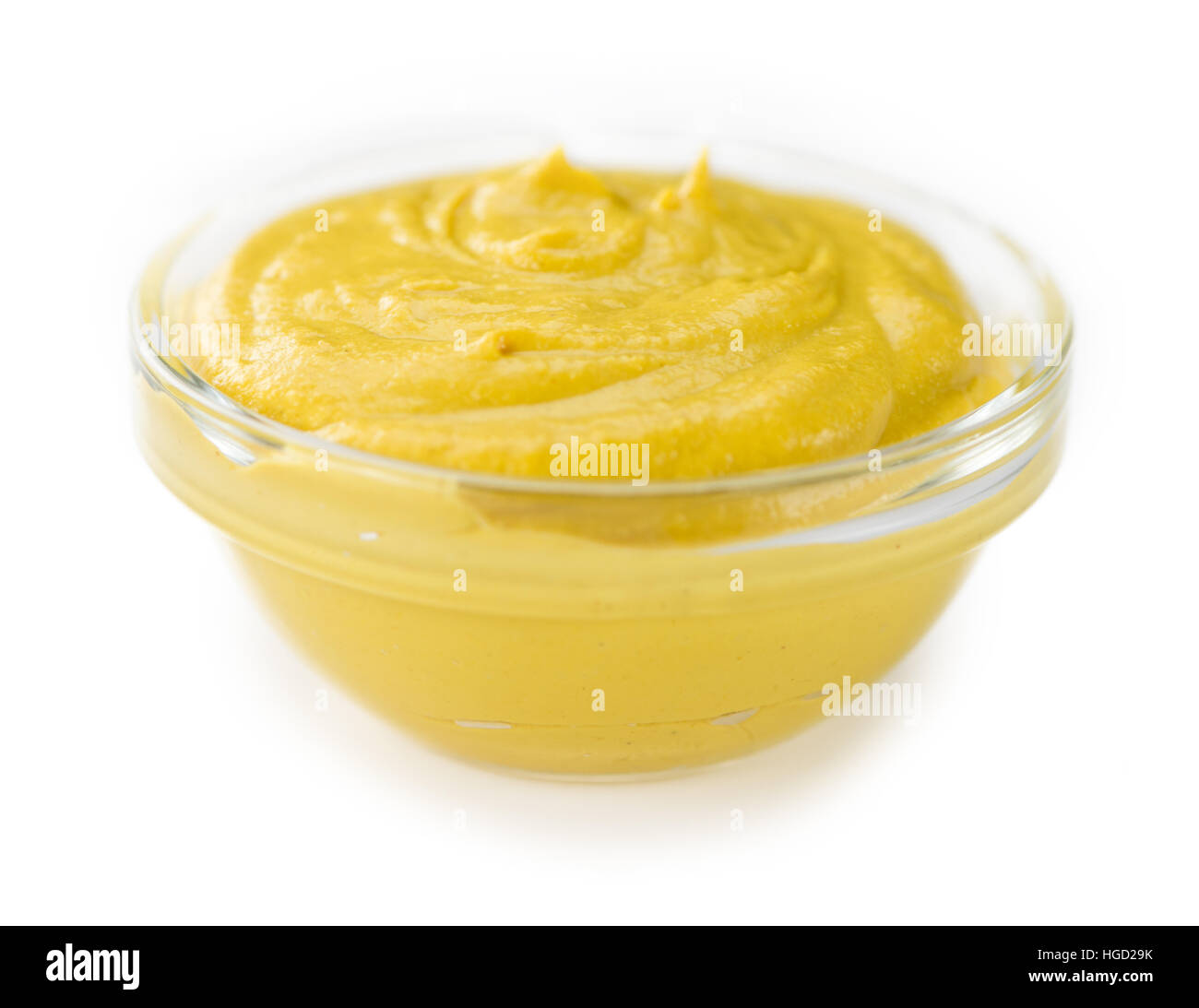 Portion of Mustard (as close-up shot) isolated on white background ...