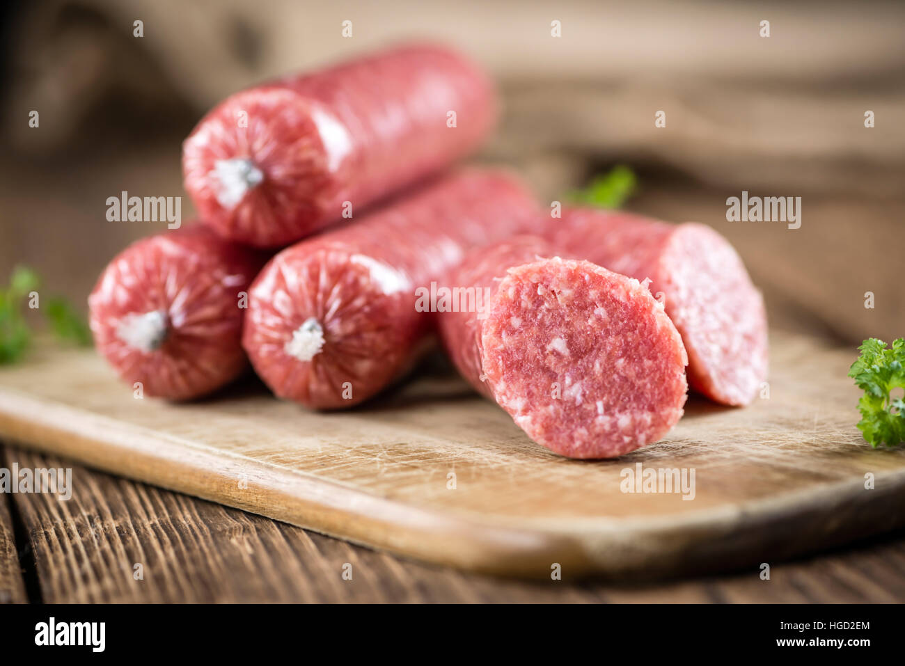 Mettwurst (German cuisine; selective focus) on vintage wooden ...
