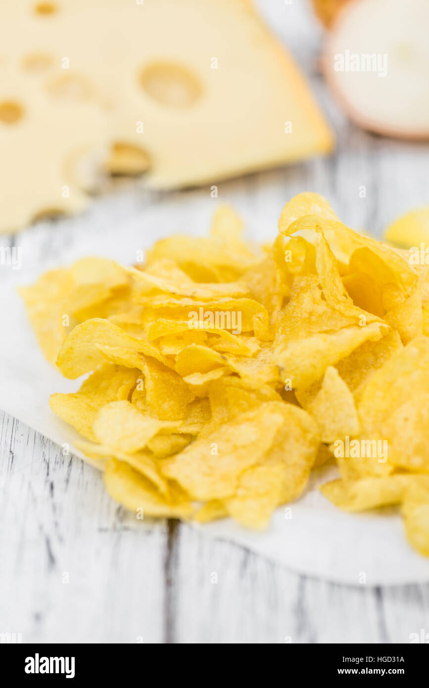 Cheese and Onion Potato Chips on rustic wooden background (close-up ...