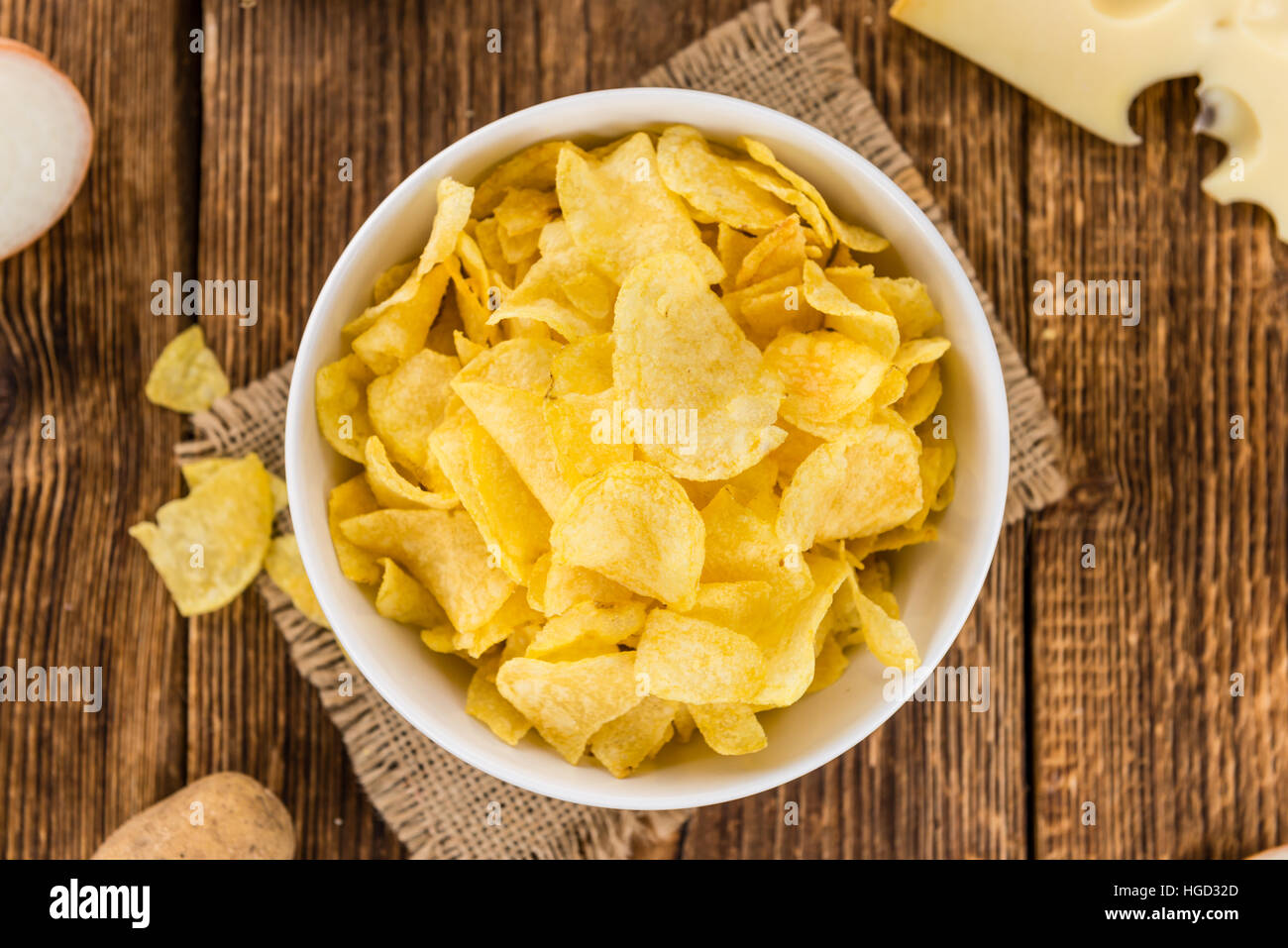 Cheese and Onion Potato Chips on a vintage background as detailed close ...