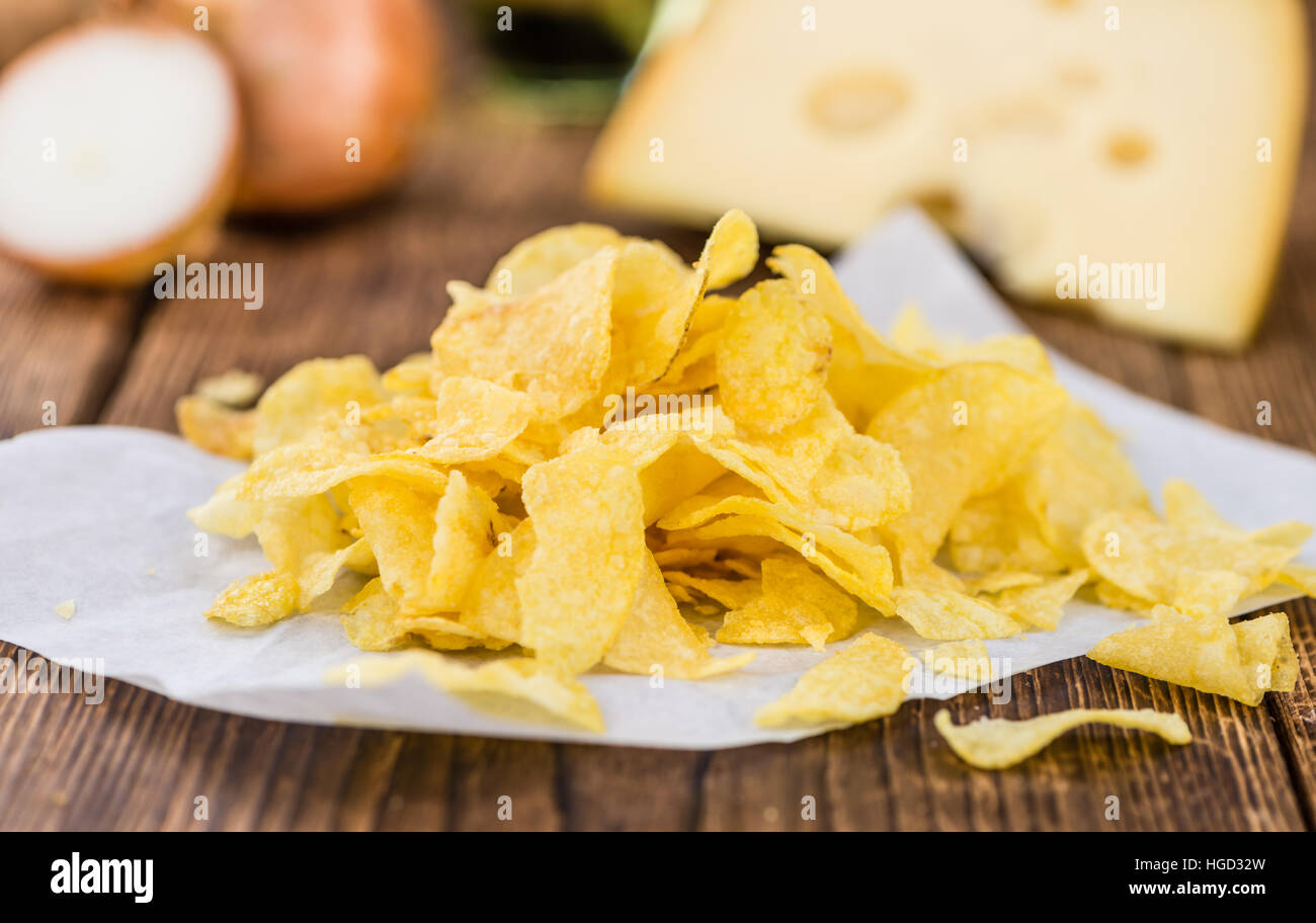 Cheese and Onion Potato Chips on rustic wooden background (close-up ...