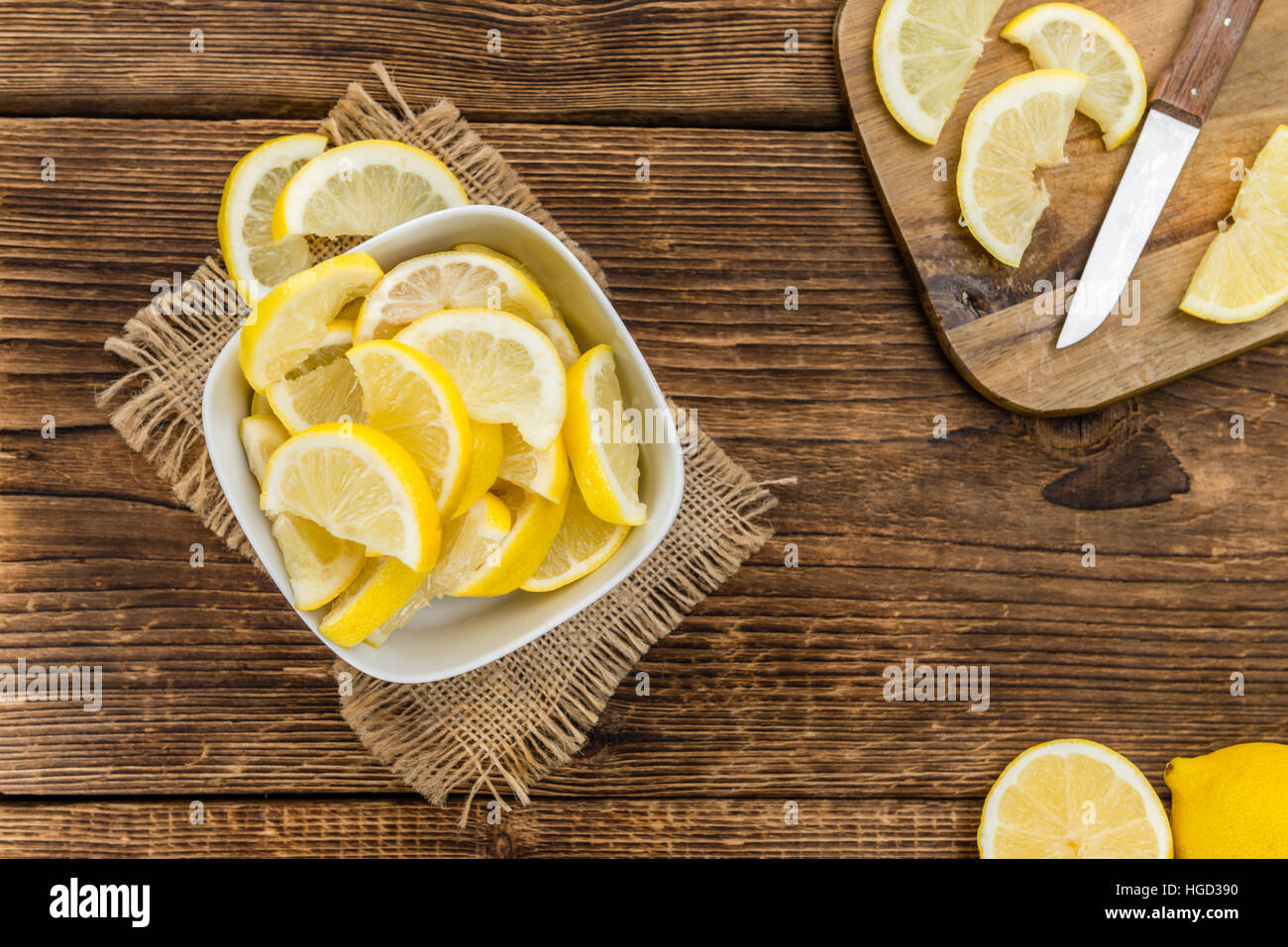 Fresh made Lemon (sliced) on an old and rustic wooden table (selective ...
