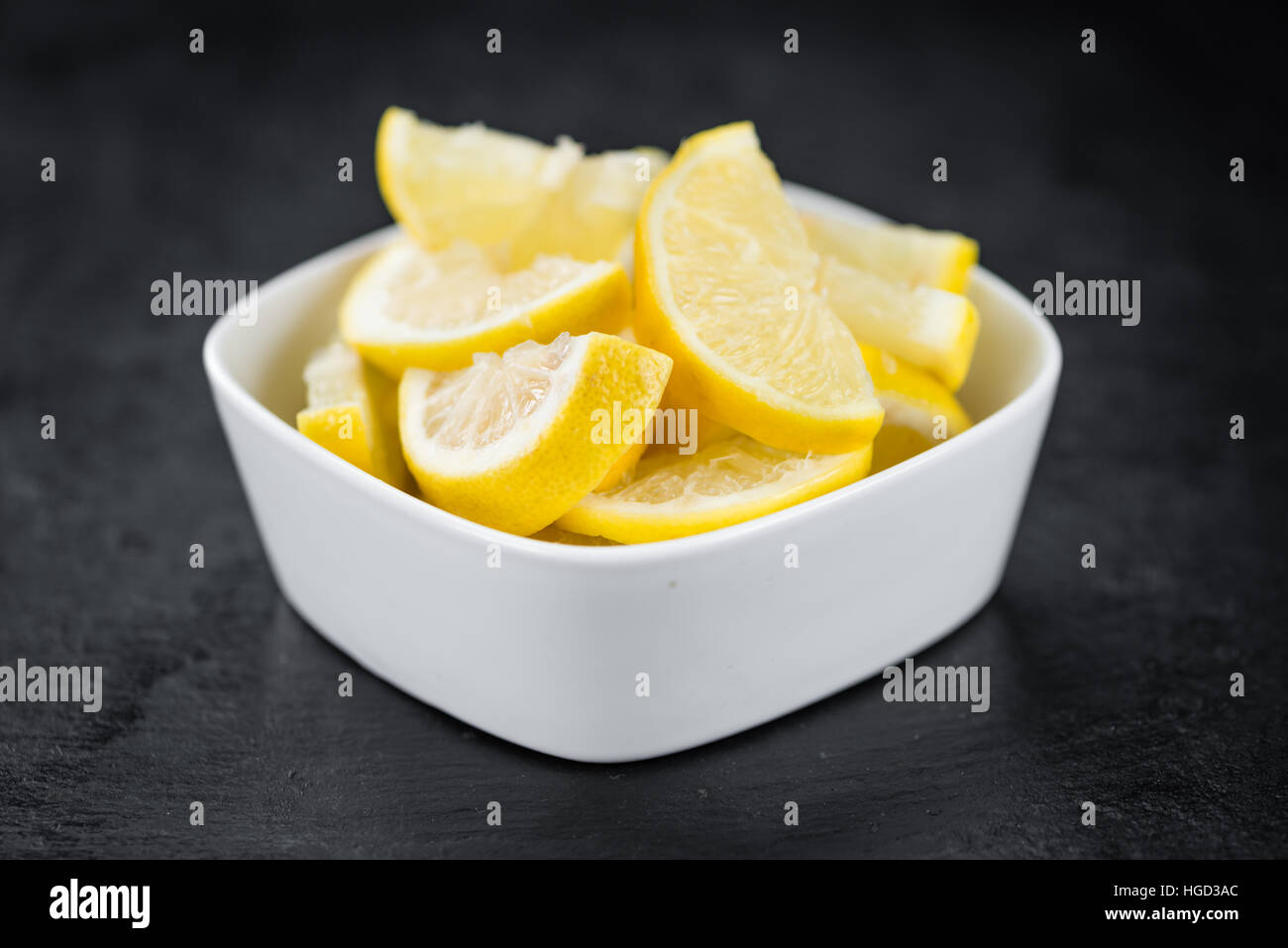 Fresh made Lemon (sliced) on a vintage background (close-up shot Stock ...