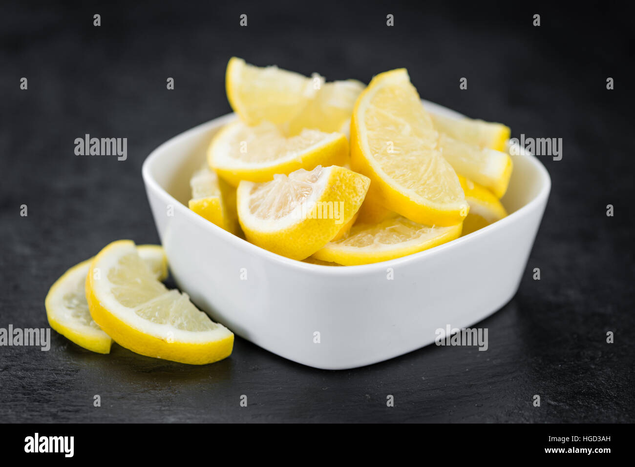 Fresh made Lemon (sliced) on a vintage background (close-up shot Stock ...