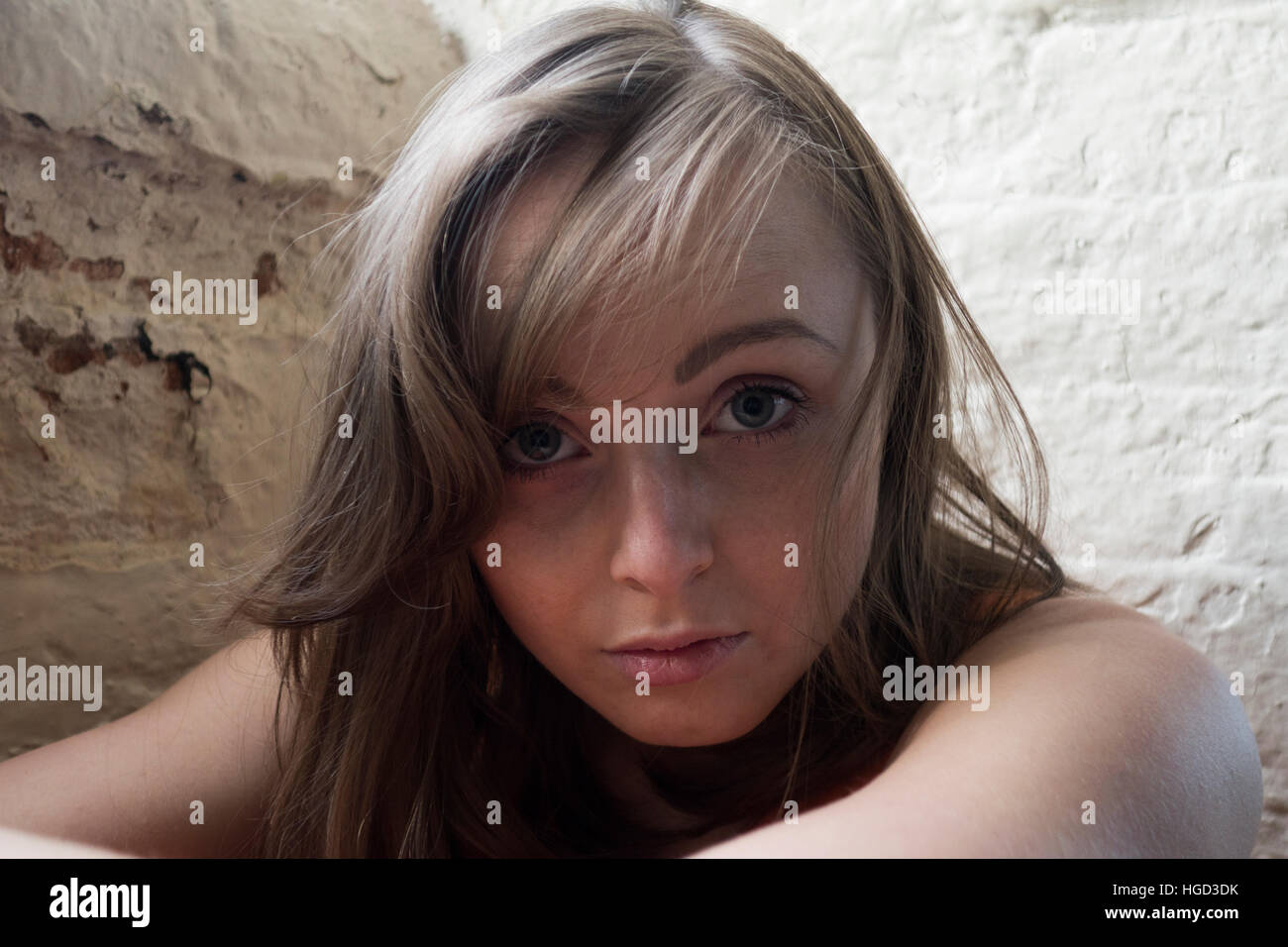 Close up portrait of a beautiful young woman staring Stock Photo - Alamy