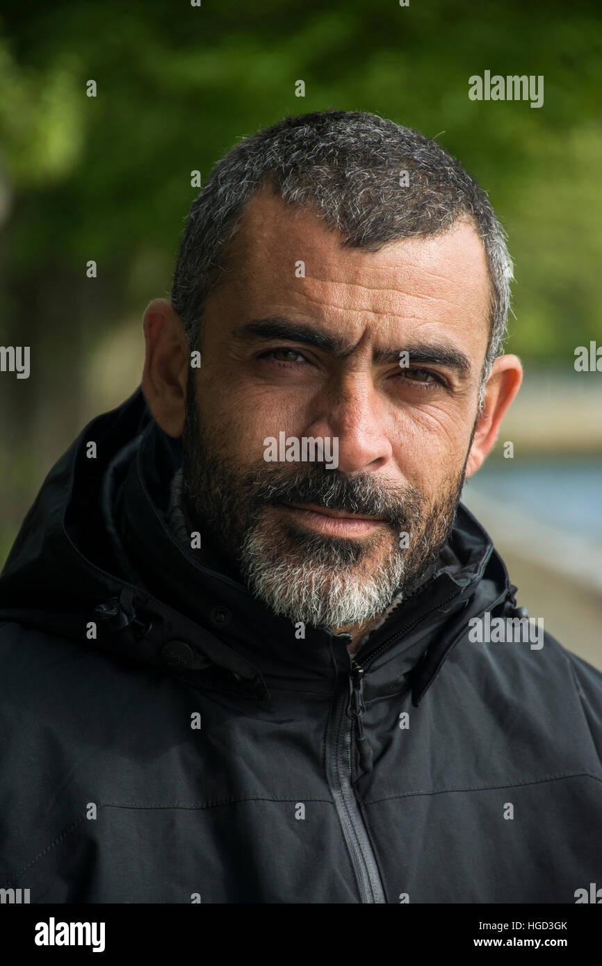 Serious man staring outdoors Stock Photo - Alamy