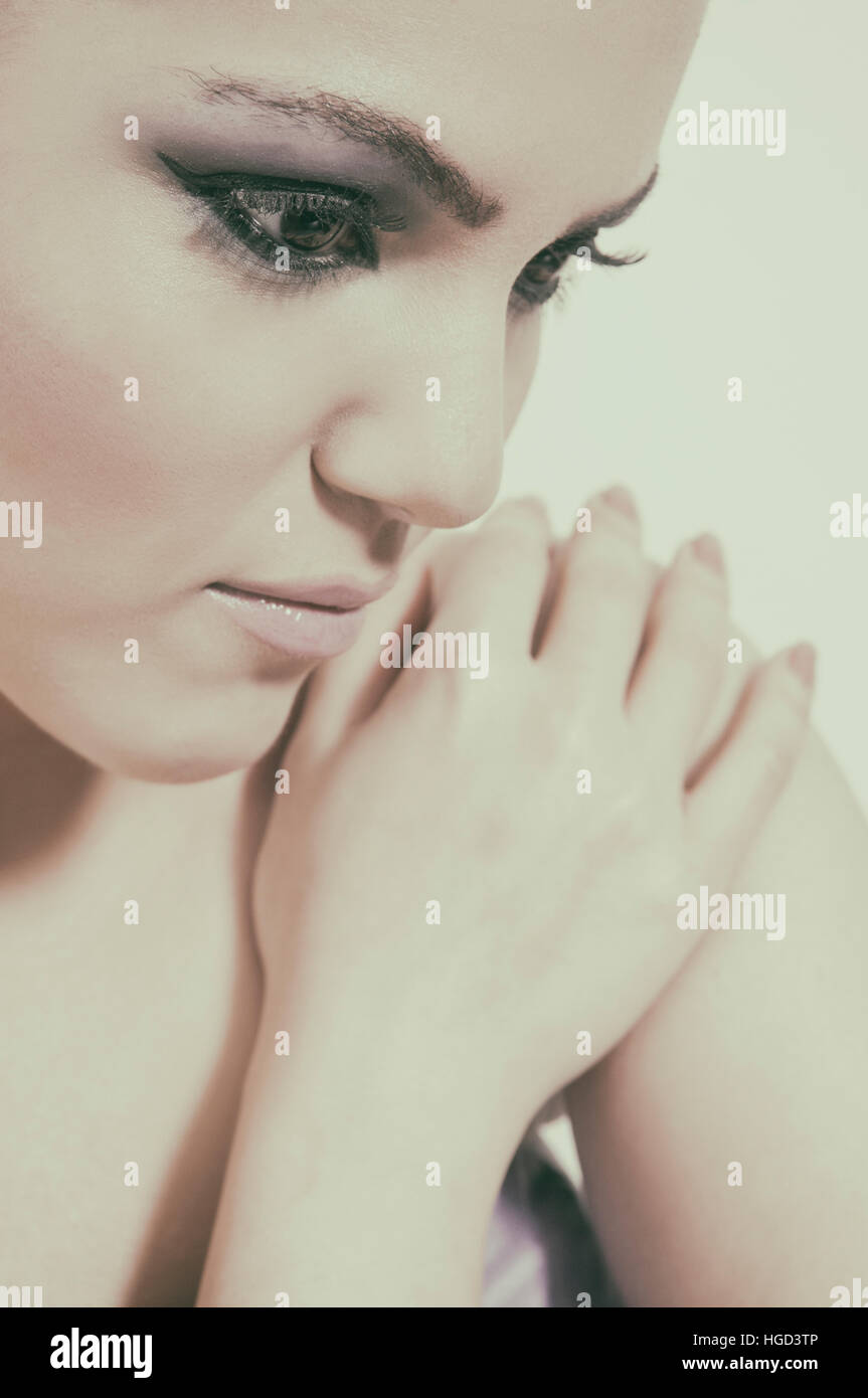 Thought young woman hand touching shoulder Stock Photo - Alamy