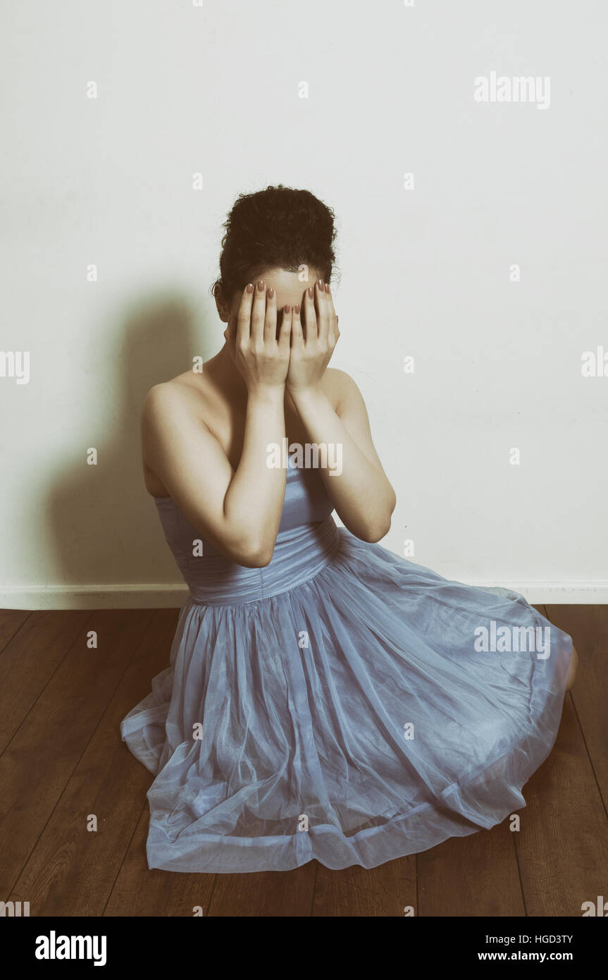 Sad woman hiding face with hands Stock Photo - Alamy