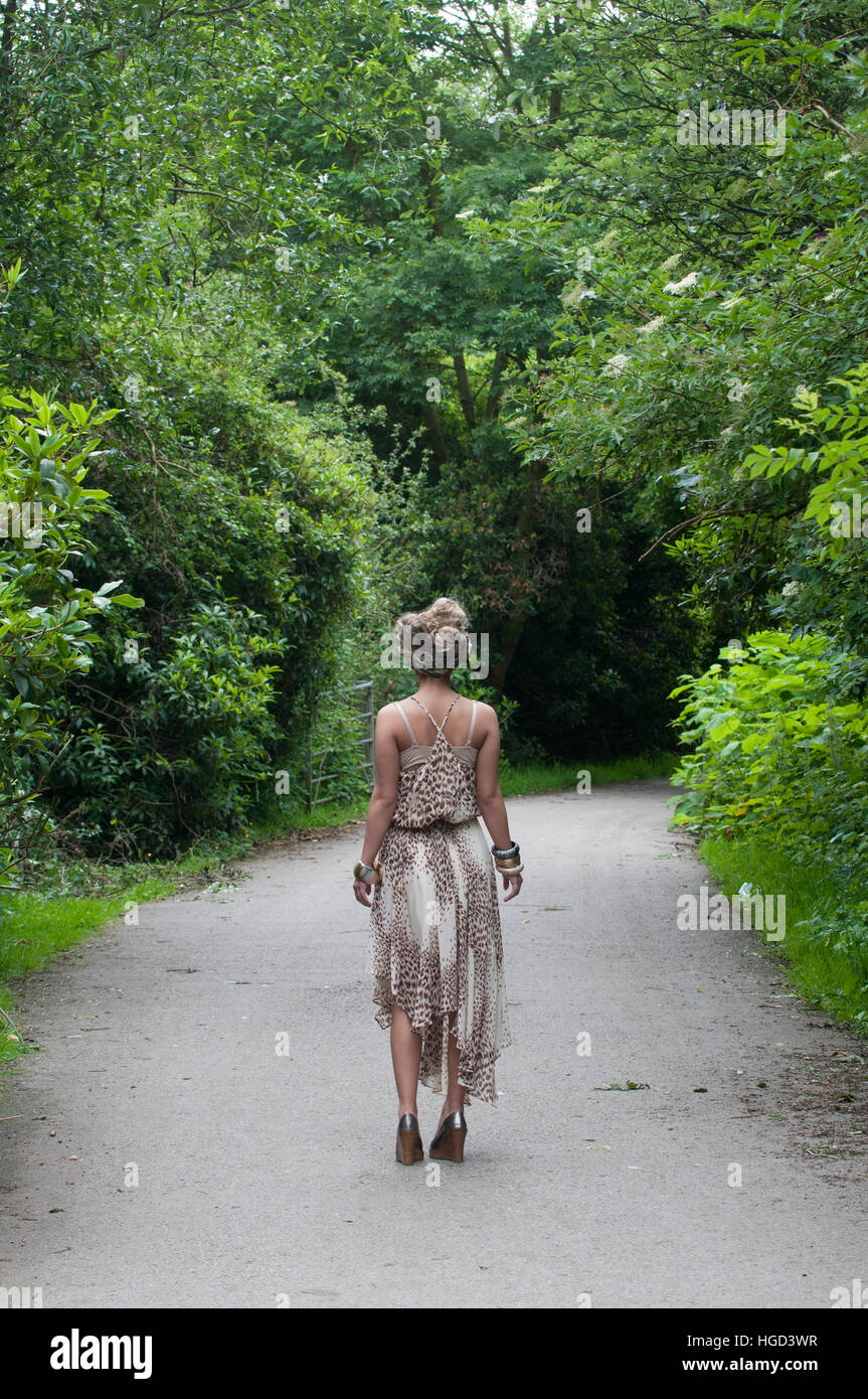 Teenage girl walking away road hi-res stock photography and images - Alamy