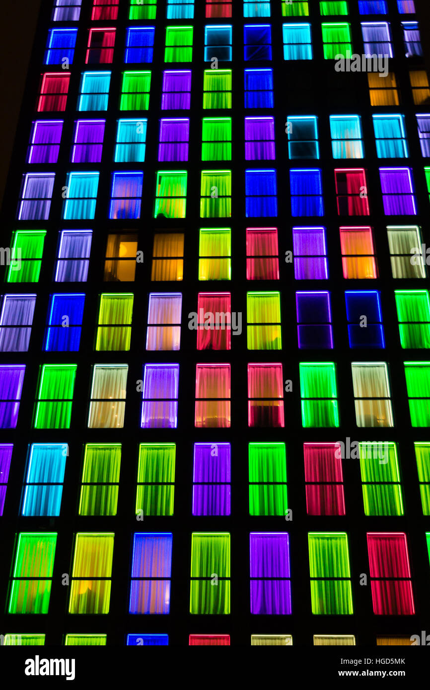 Colored windows texture. Windows illuminated by neon lights background ...