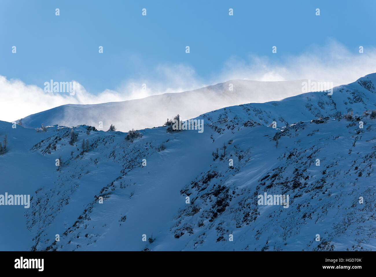 Wind blowing snow off mountain hi-res stock photography and images - Alamy