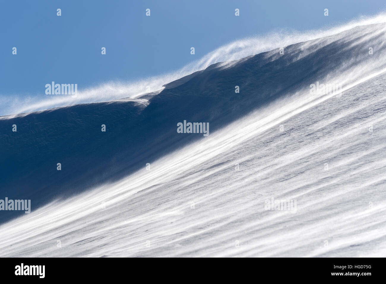 Windblown snow, also known as spindrift, on a ridge high in Oregon's ...