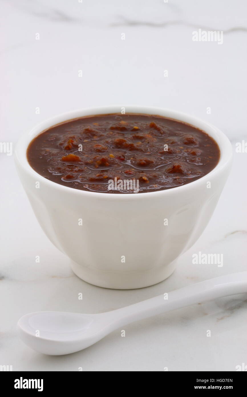 Artisan mexican chipotle sauce on vintage carrara marble table, with a ...