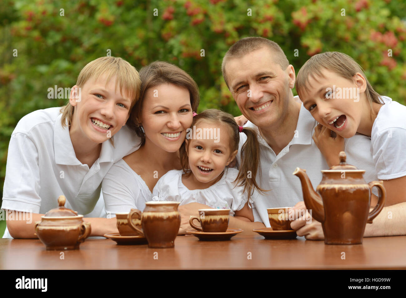 happy family drinking tea Stock Photo - Alamy