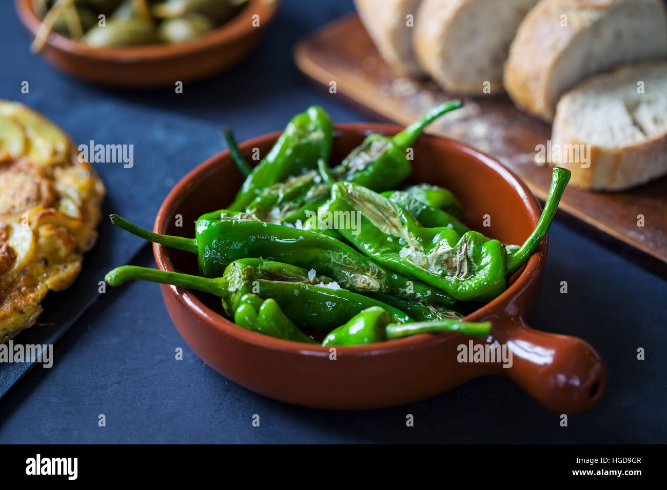 Authentic Spanish tapas with padron peppers Stock Photo - Alamy