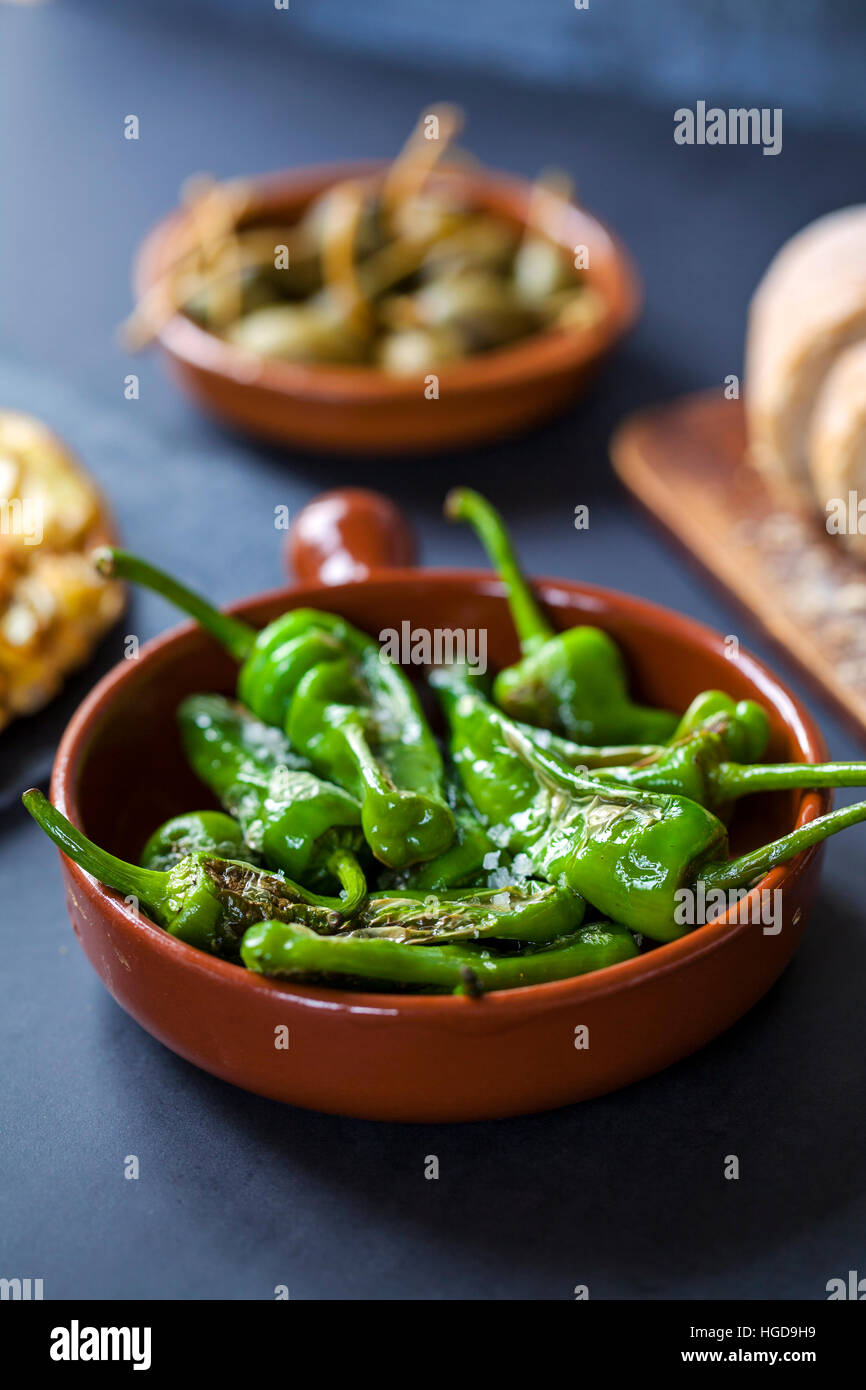 Authentic Spanish tapas with padron peppers Stock Photo - Alamy