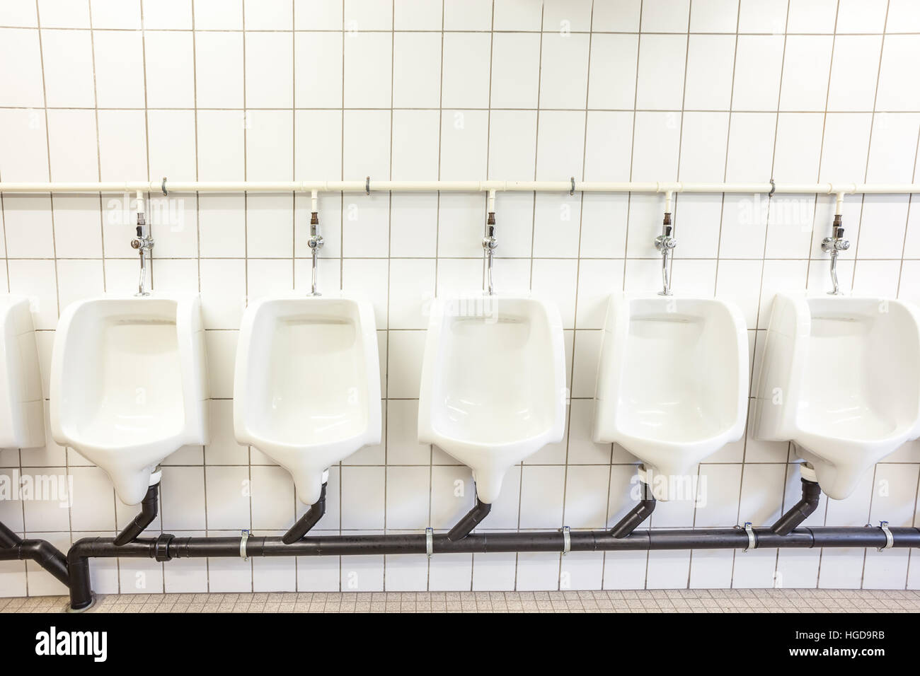 urinals in an old building for men only Stock Photo - Alamy