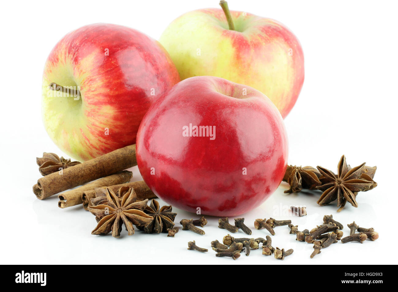 Three shiny fresh red Elstar apples (Malus domestica) with cinnamon and ...