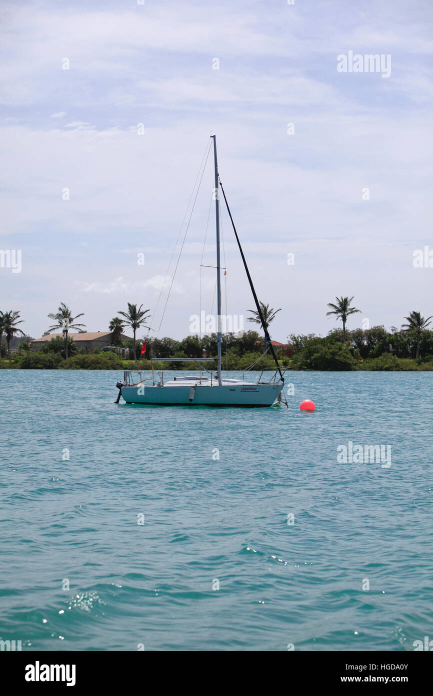Sailboat anchored in turquoise bay hi-res stock photography and images ...
