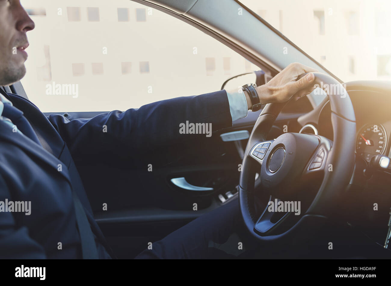 Driver holds steering wheel. Horizontal outdoors shot Stock Photo - Alamy