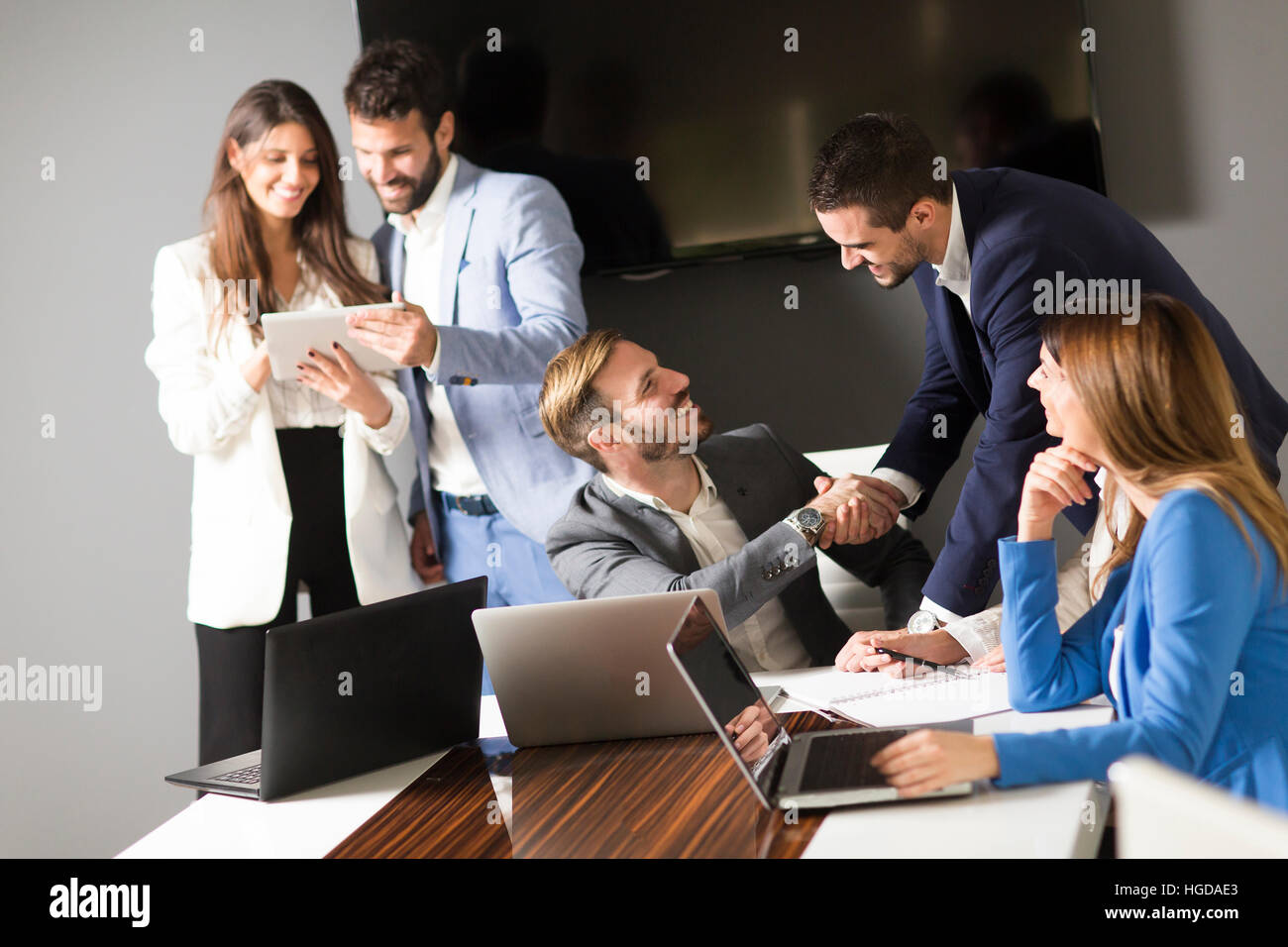 View at young business people keeping team building in a modern office Stock Photo - Alamy