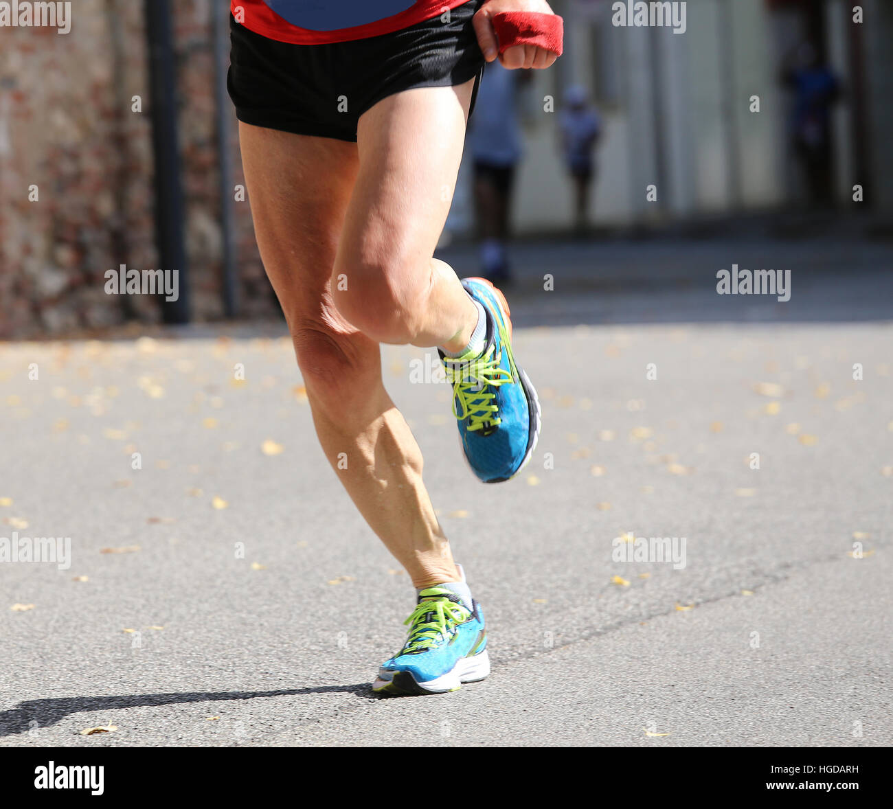 fast runner runs during the international sporting event on a paved ...