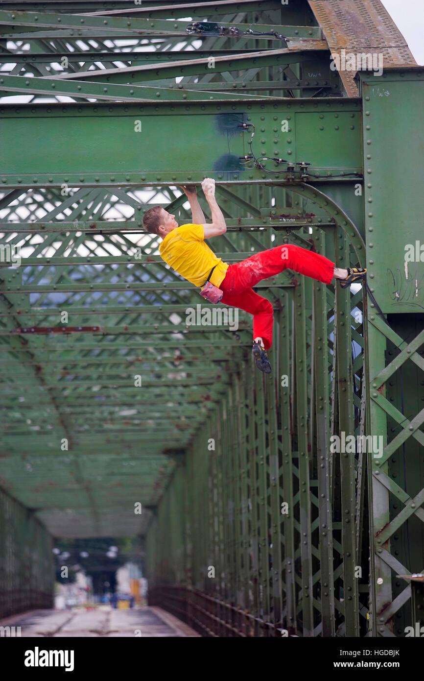 urban climbing on a bridge Stock Photo - Alamy