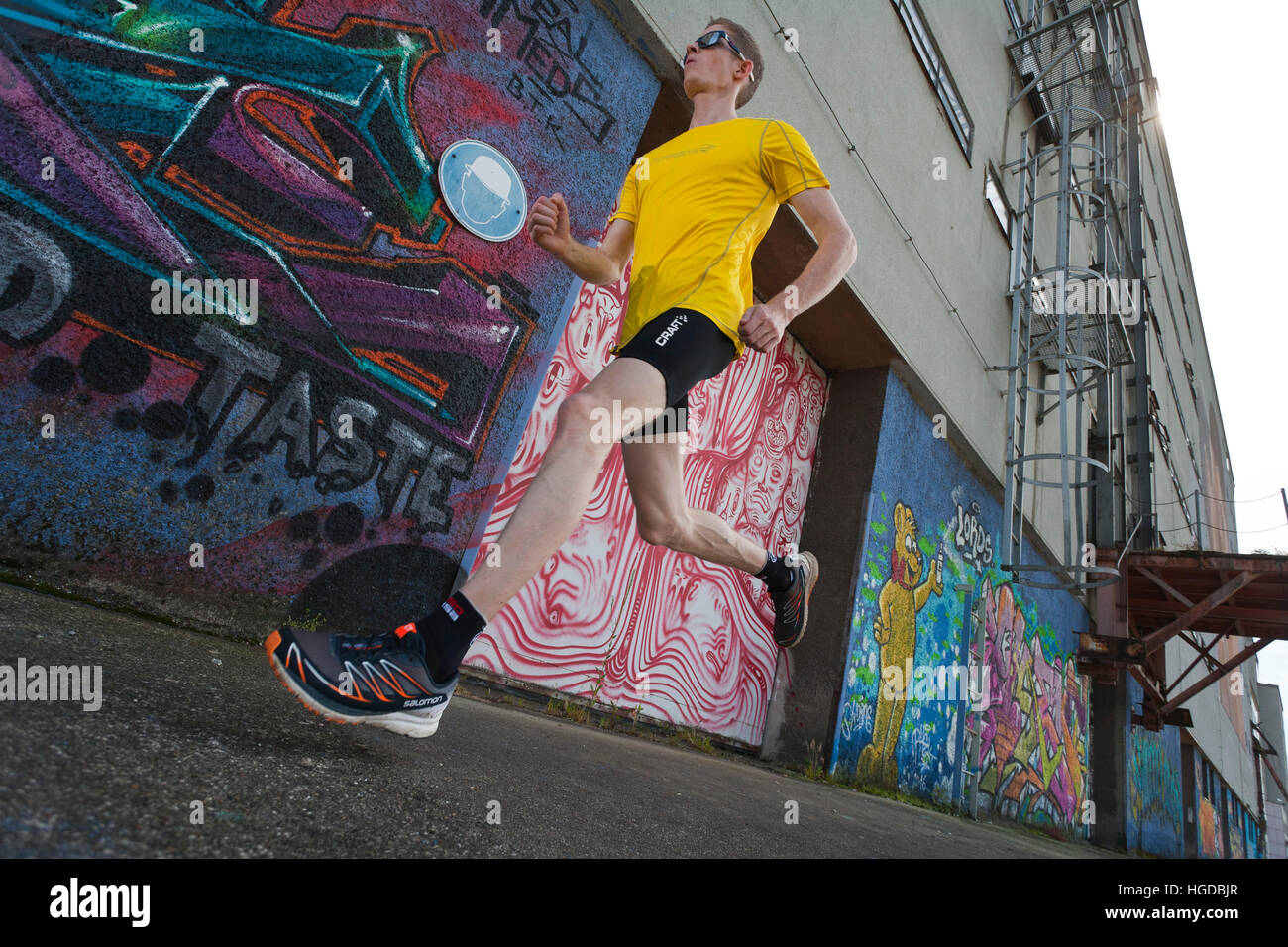 urban jogging at a factory Stock Photo - Alamy