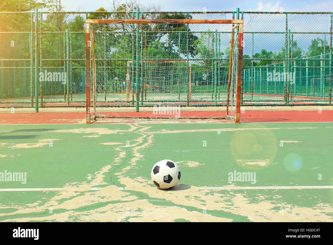 ball in front of futsal goal at outdoor street futsal with sun flare ...