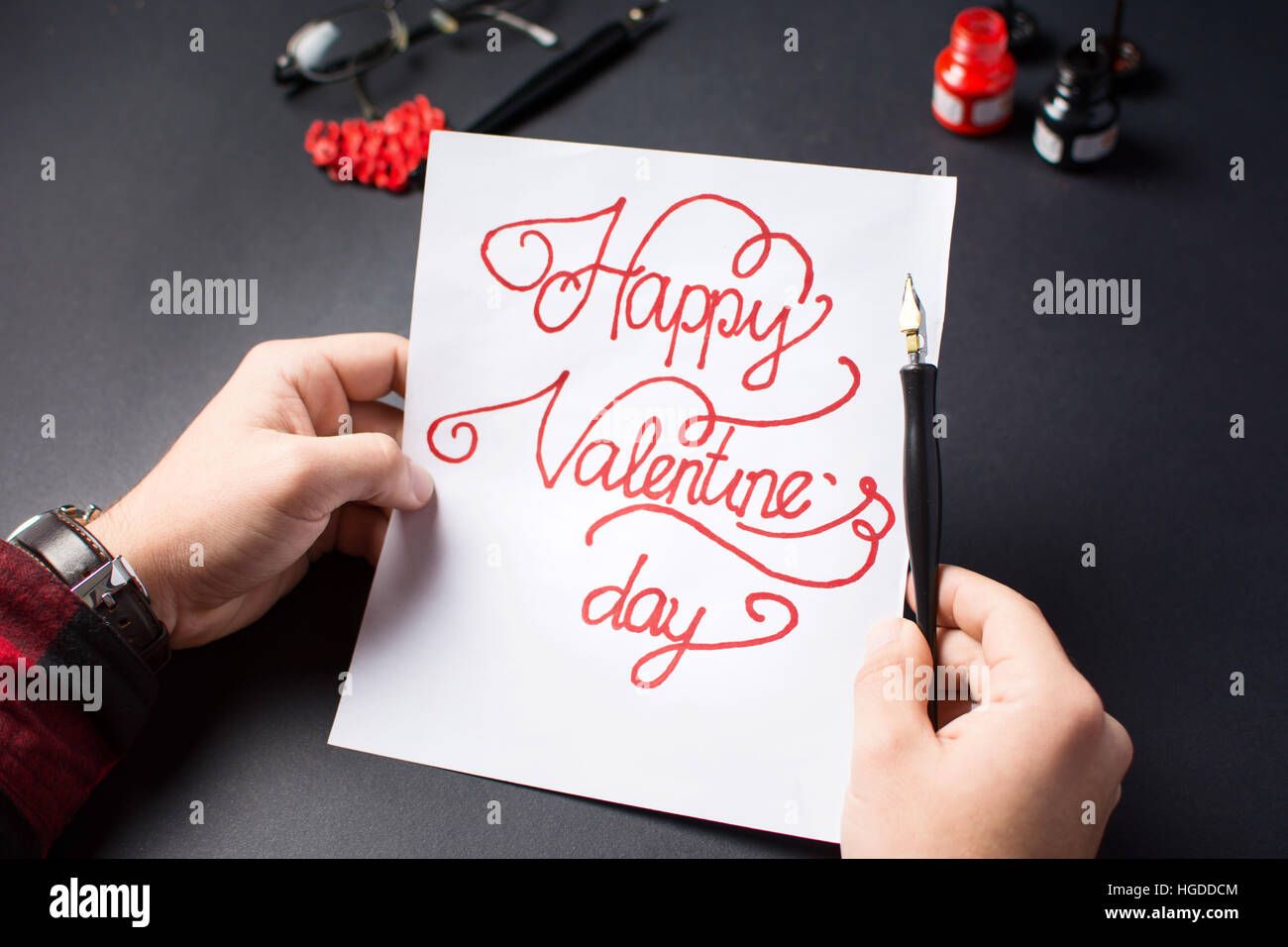 male hands writing a Valentine's day card calligraphy Stock Photo - Alamy