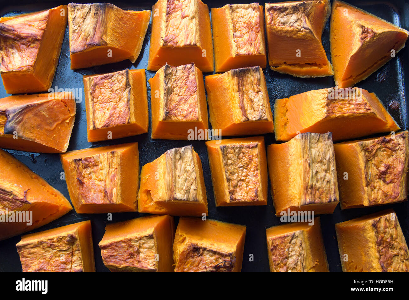 Roasted pumpkin slices on a cooking plate Stock Photo - Alamy