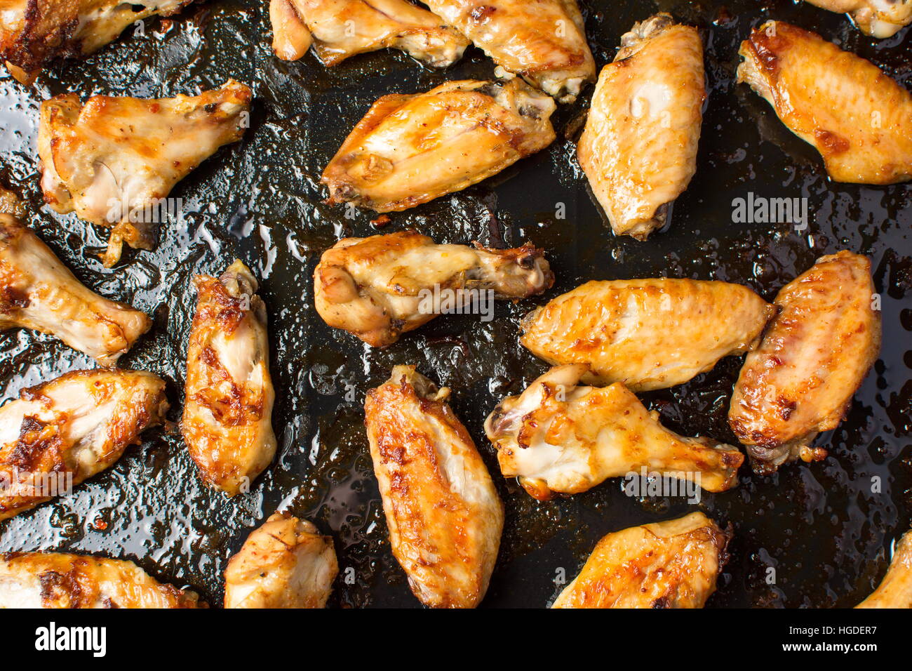 Delicious roasted chicken wings golden hi-res stock photography and ...